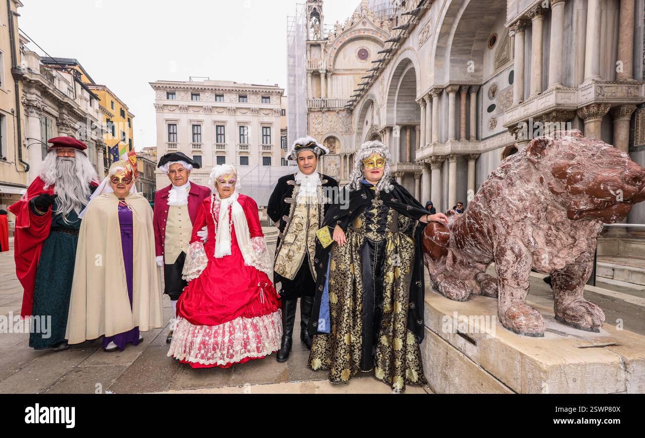 venice, Italy. 22nd Feb, 2025. Revellers by San Marks in colourful ...