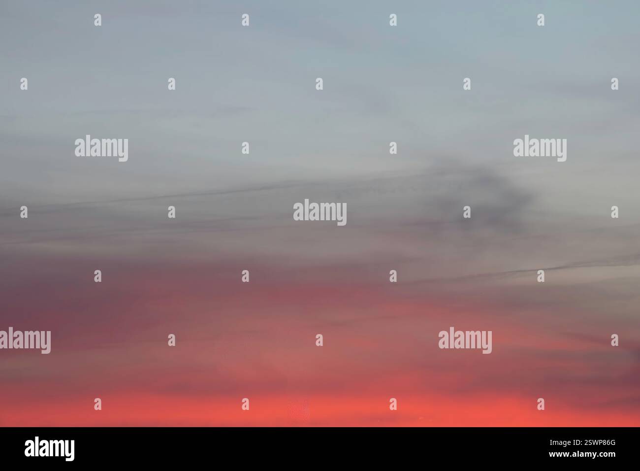 A beautiful gradient sky with colors ranging from fiery red at the ...