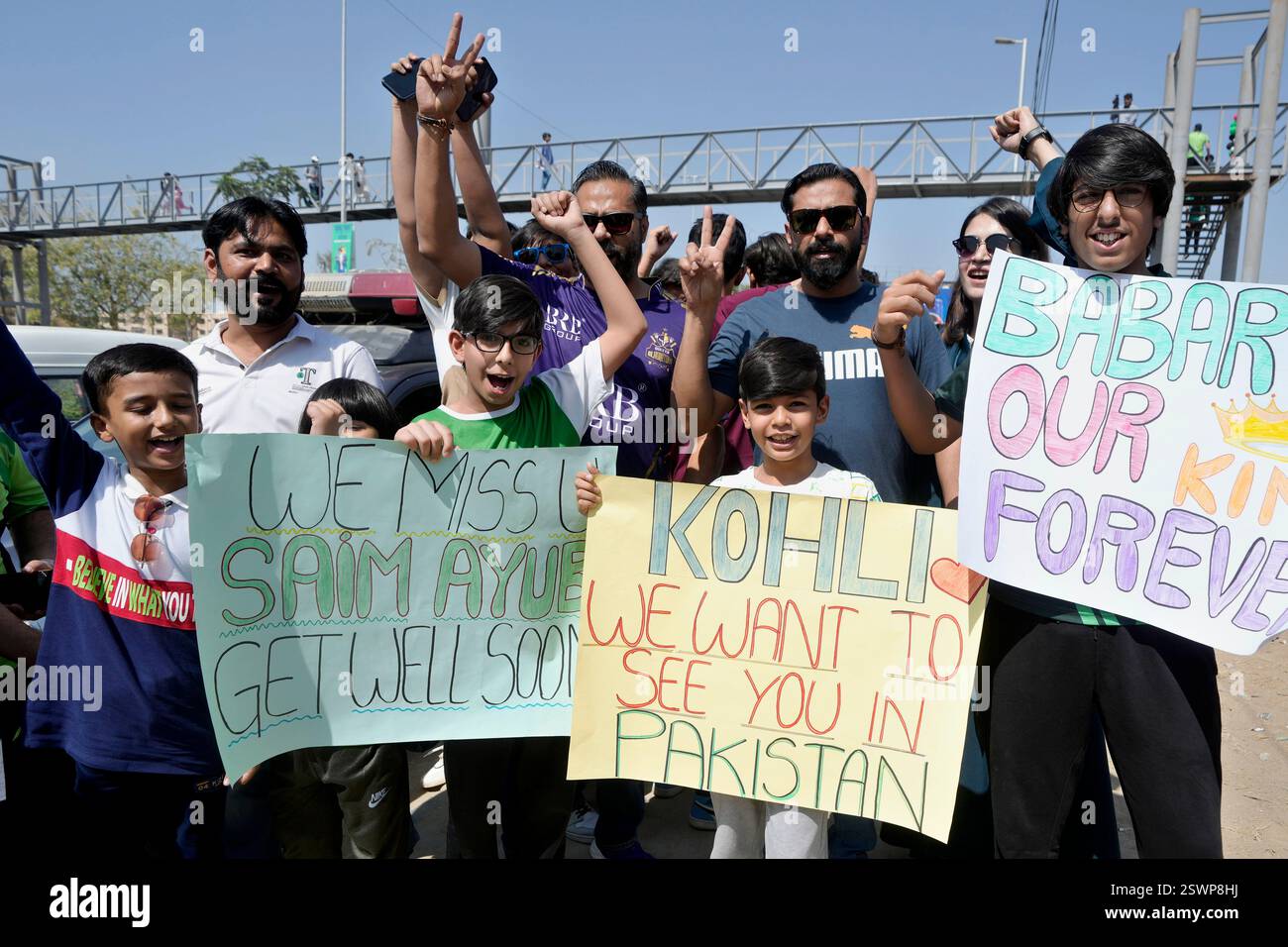 A fan holds a placard reading 'Kohli we want to see you in Pakistan' as ...