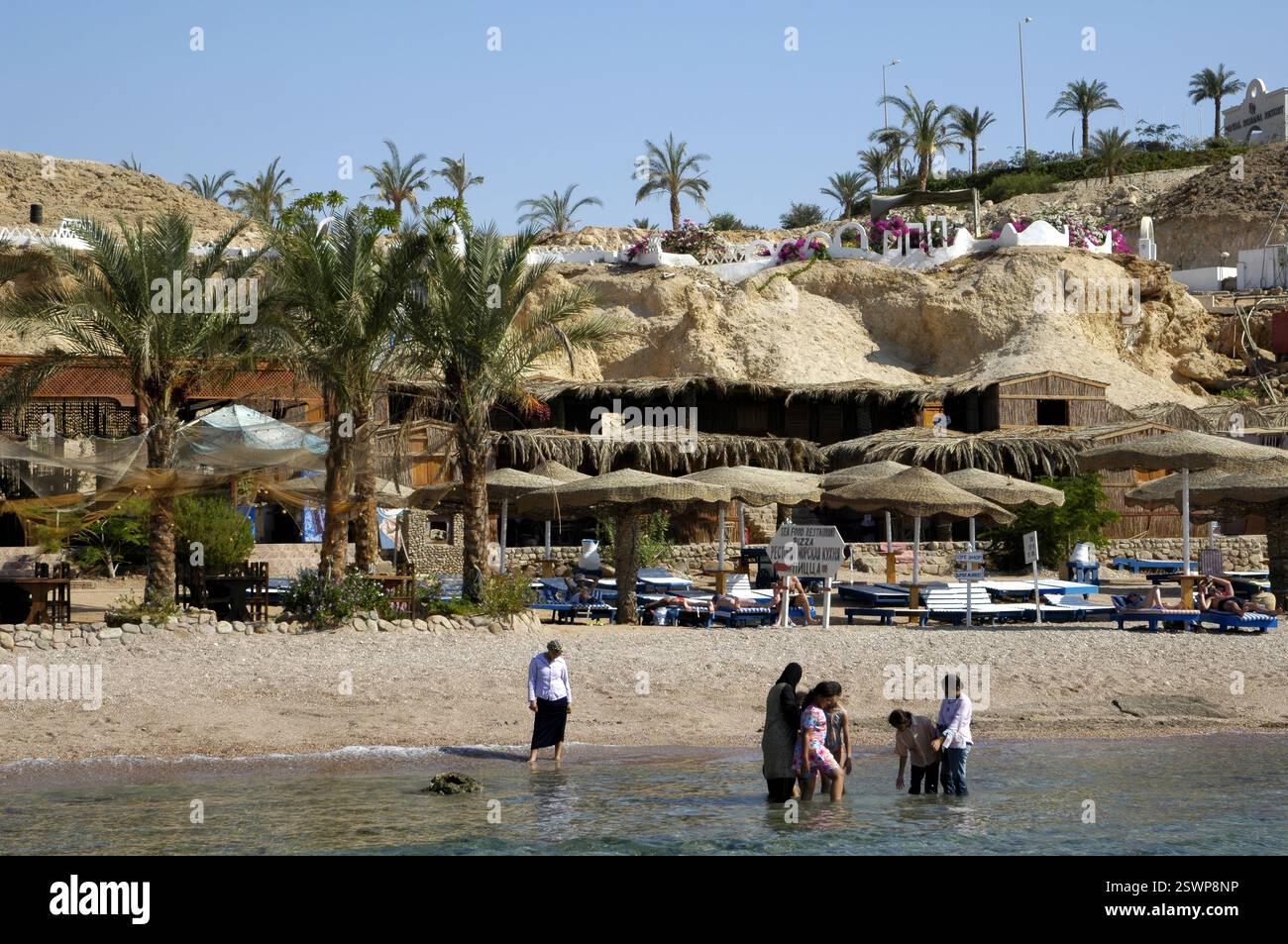 Egyptians stand at the shore of Shark bay in Sharm el Sheikh a resort ...