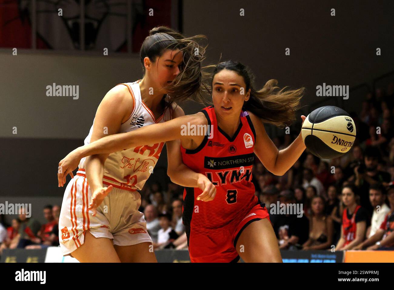 Alexandra Ciabattoni of the Lynx drives past Alex Fowler of the Fire ...