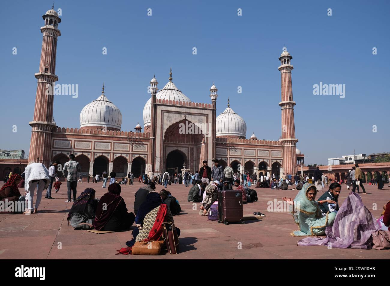 Indian relax in the courtyard of the Jama Masjid, the main mosque in ...