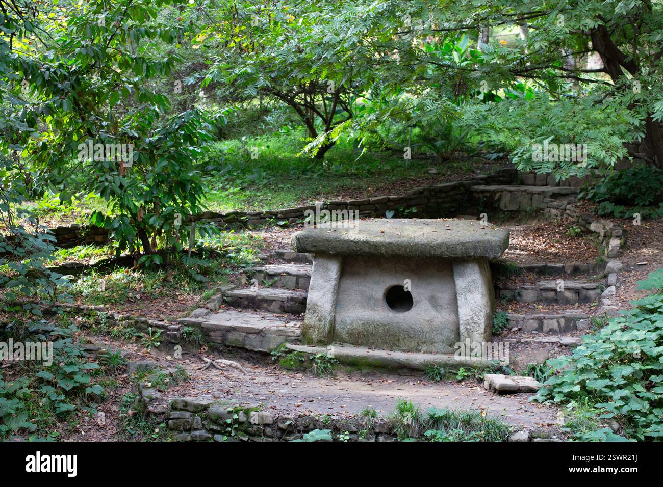 The Stone Dolmen. Decorative dolmen in Sochi arboretum. megalithic ...