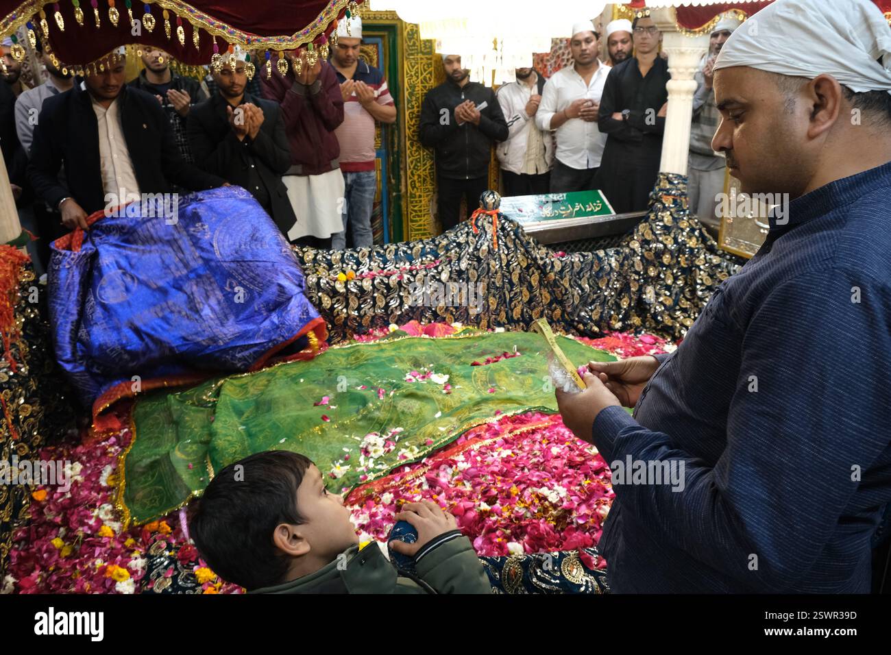 Father and son in the tomb of Nizamuddin Auliya, a 13th Century Sufi ...