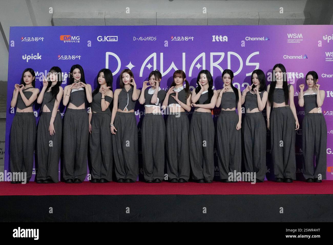 Members of South Korean K-Pop group tripleS pose for photos during the ...