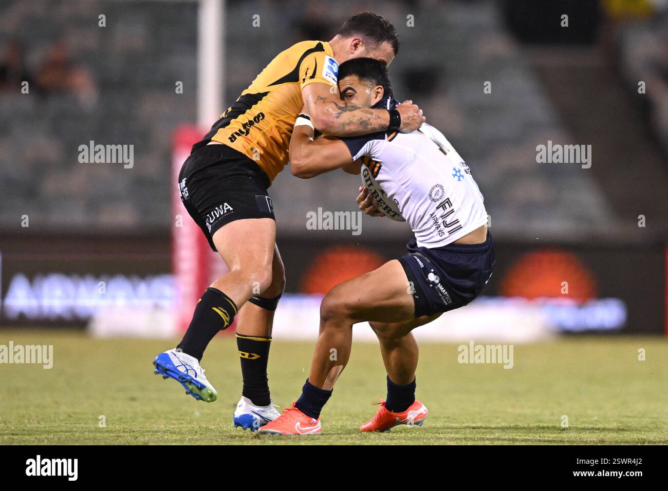 Harry Potter of the Western Force tackles Andy Muirhead of the Brumbies ...