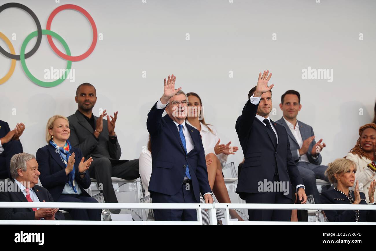 July 26th, 2024 - Paris, France: Thomas Bach and Emmanuel Macron wave ...