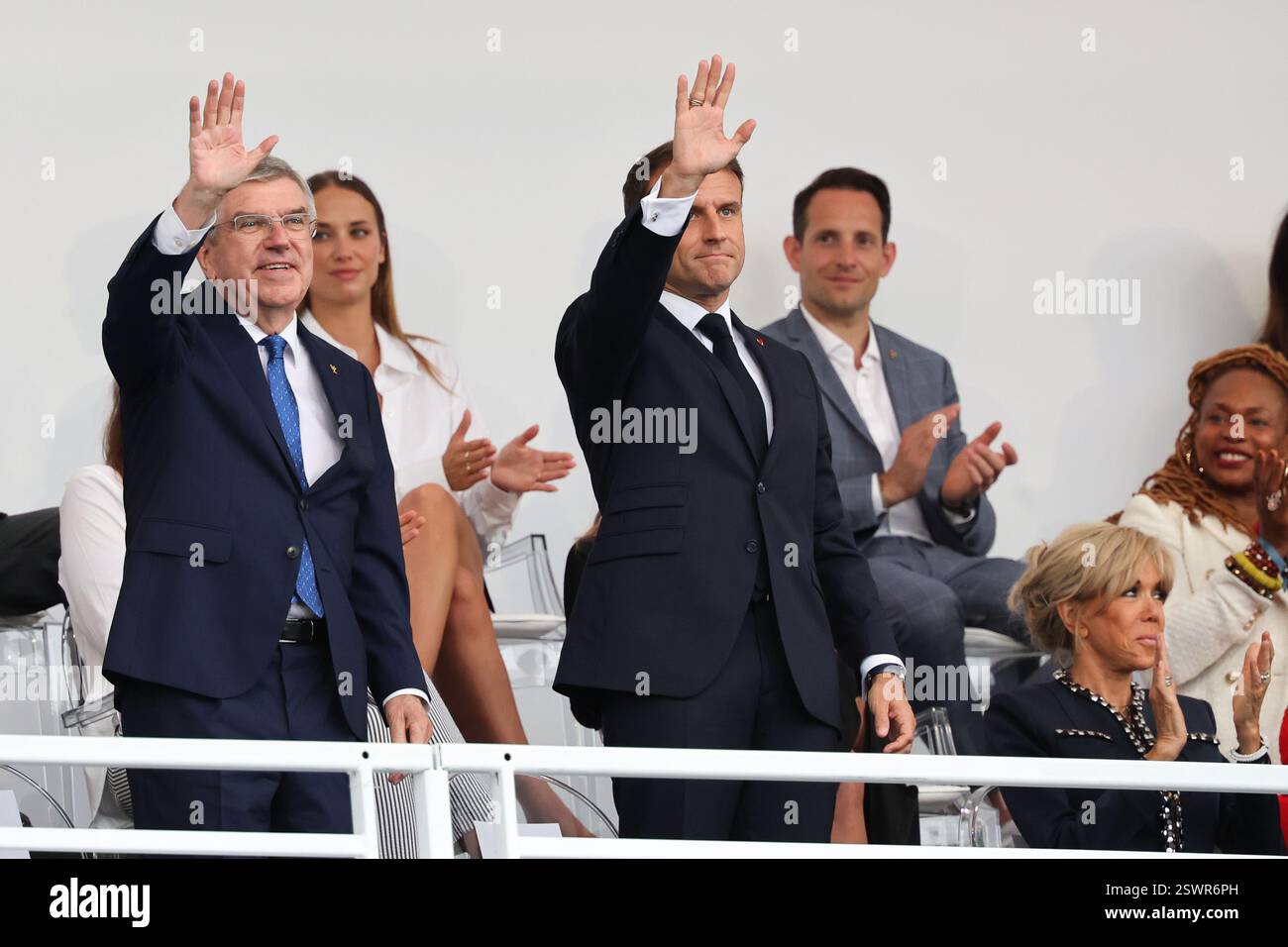 July 26th, 2024 - Paris, France: Thomas Bach and Emmanuel Macron wave ...