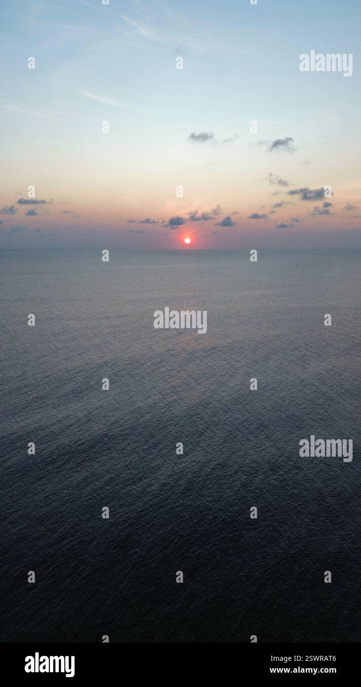 Stunning Sunset at Uluwatu: Aerial View of the Ocean and Horizon Stock ...