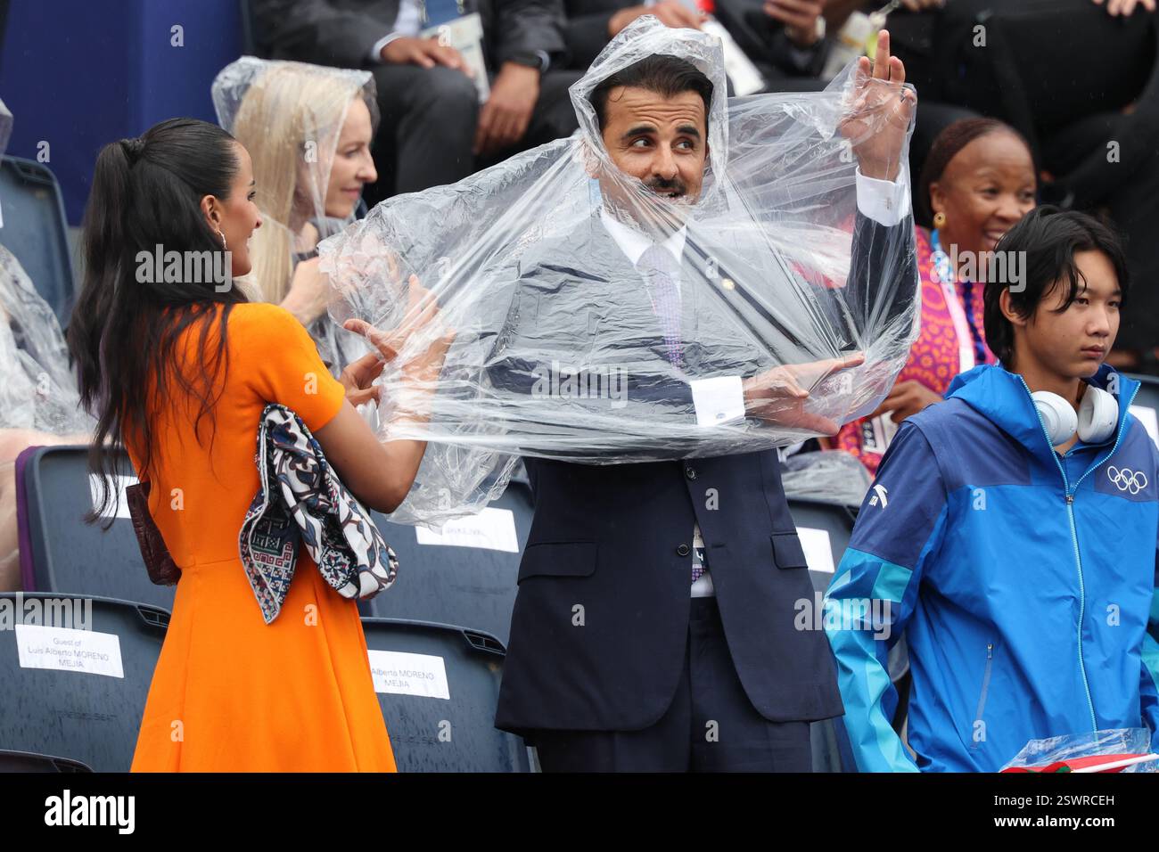 July 26th, 2024 - Paris, France: first wife Jawaher bint Hamad Al Thani helps her husband Emir ...