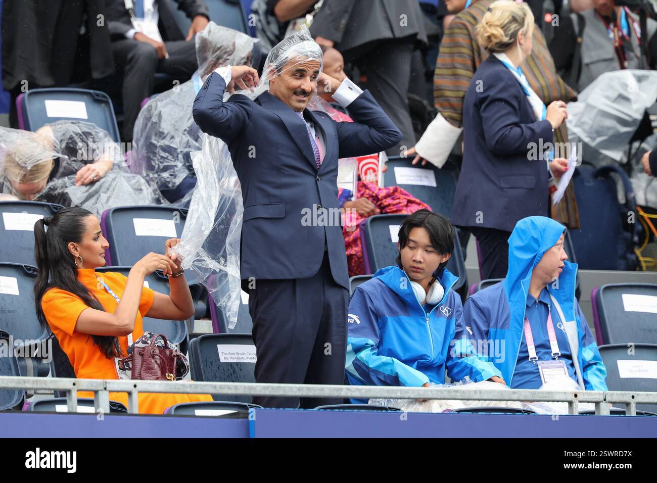 July 26th, 2024 - Paris, France: first wife Jawaher bint Hamad Al Thani helps her husband Emir ...
