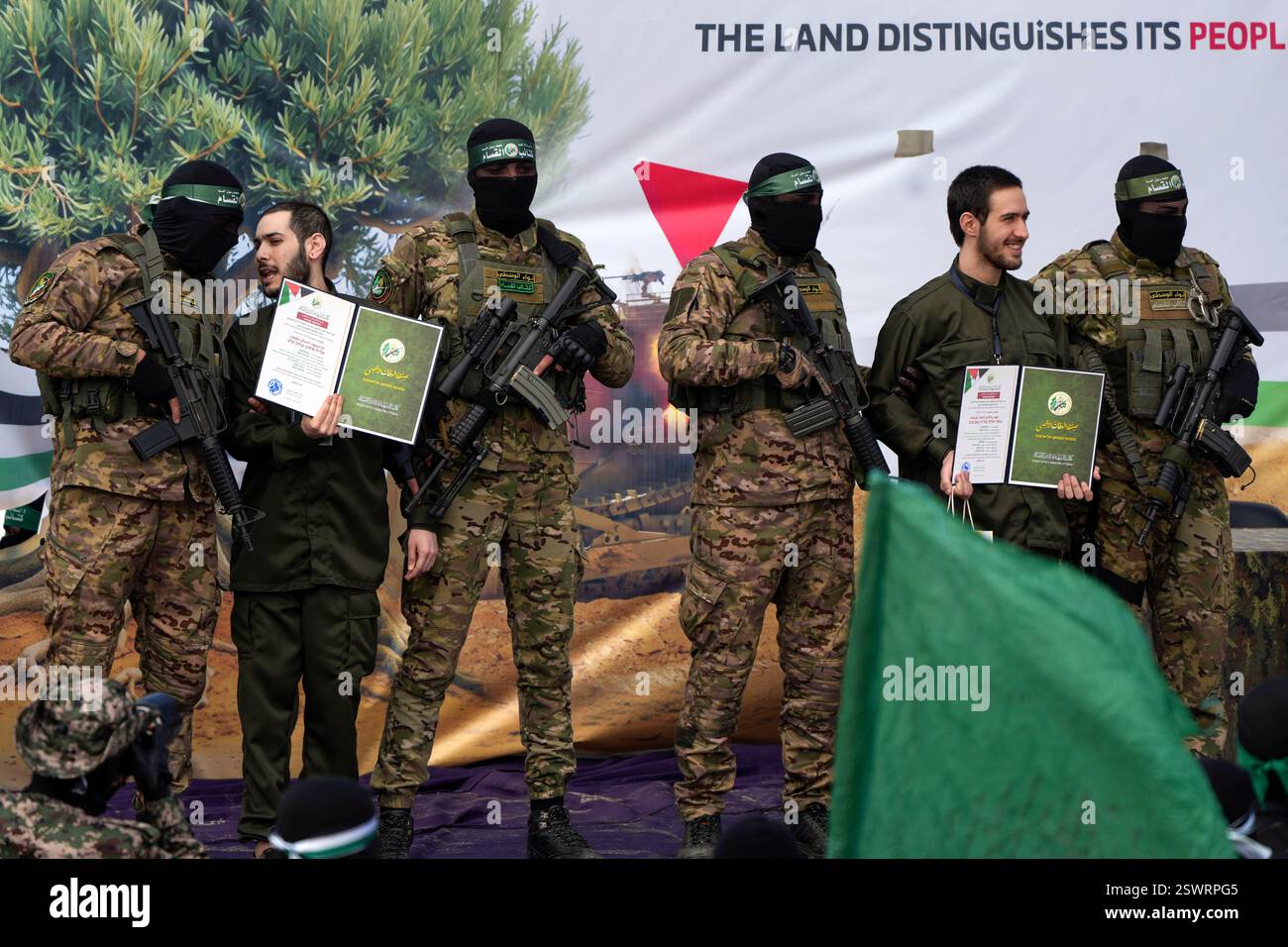 Israeli hostages Eliya Cohen, left, and Omer Shem Tov are escorted by ...