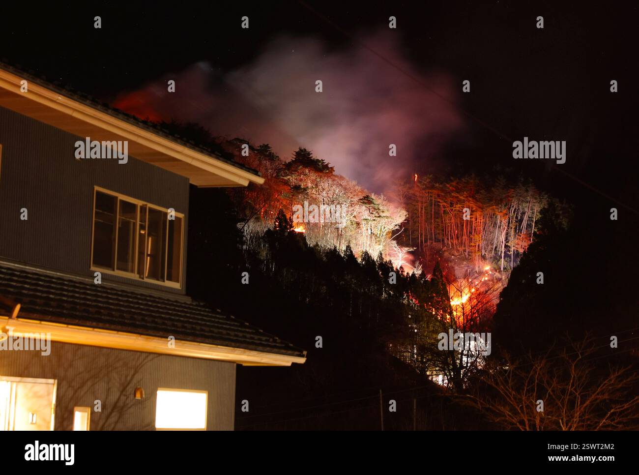 A photo shows a forest fire, continues to spread in Ofunato City, Iwate ...