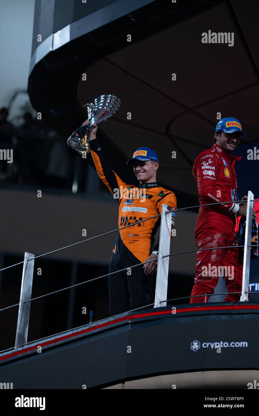 Lando Norris of Mclaren, winner of the 2024 Abu Dhabi Grand Prix on the podium with his trophy ...
