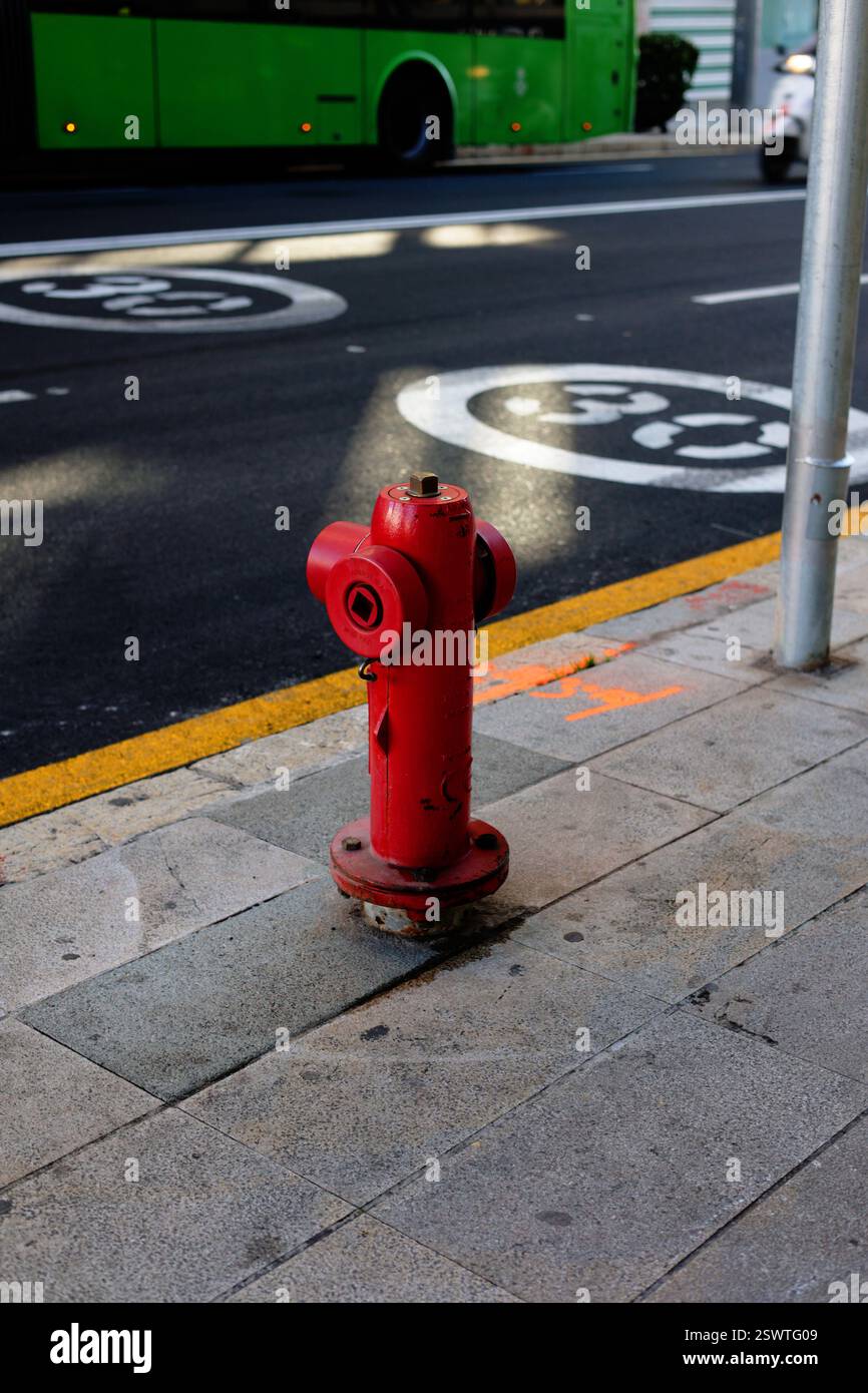 fire hydrant red on street against yellow marking stripes Stock Photo ...