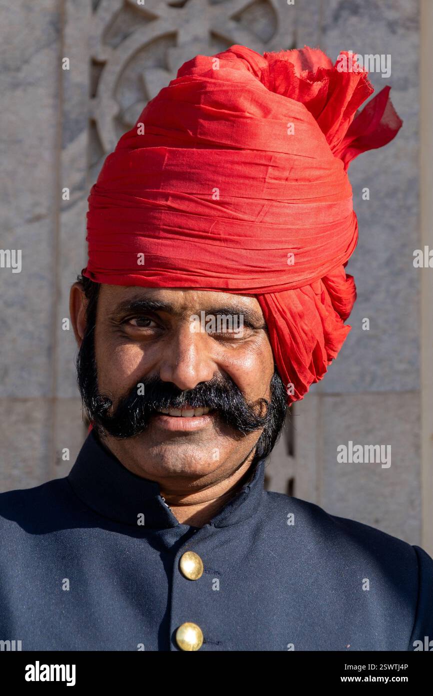 India. Rajasthan. Jaipur. City Palace. Portrait of a guard wearing the ...