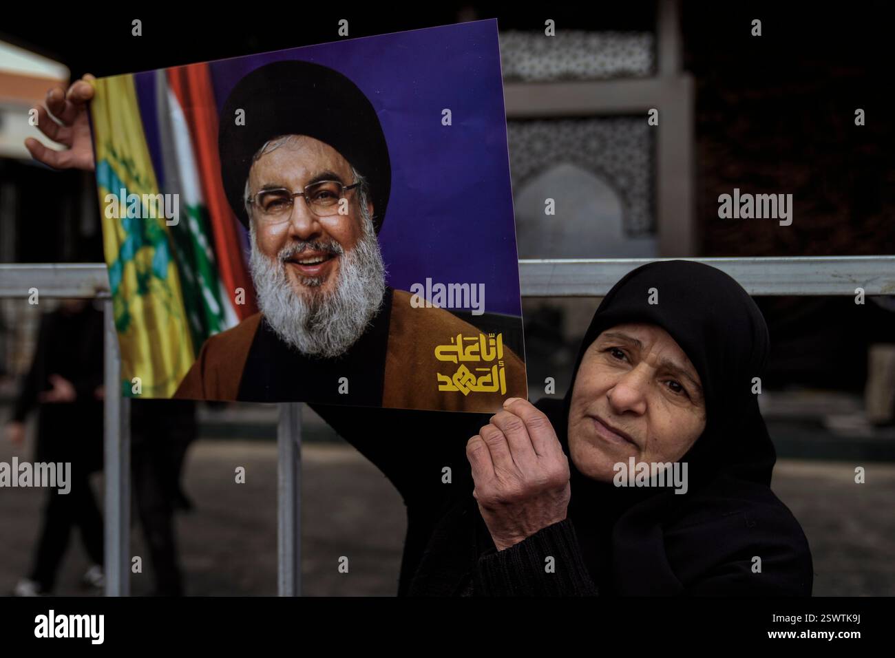 An Hezbollah supporter holds a picture of the late Lebanon's Hezbollah ...