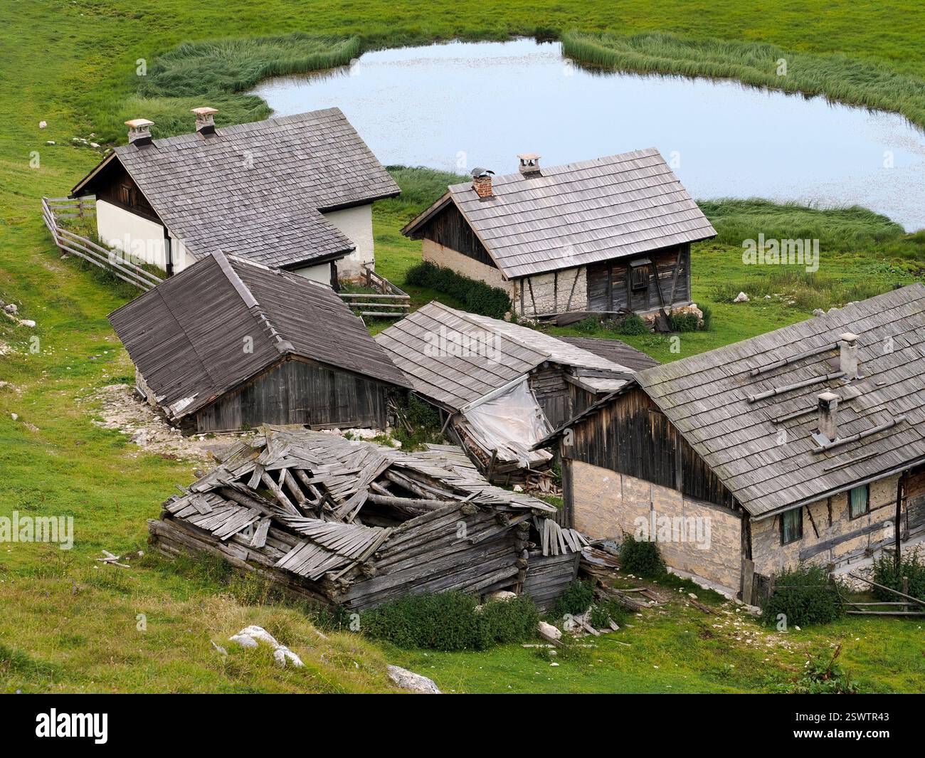 ruins of collapsed wooden hut in dolomites view Stock Photo - Alamy