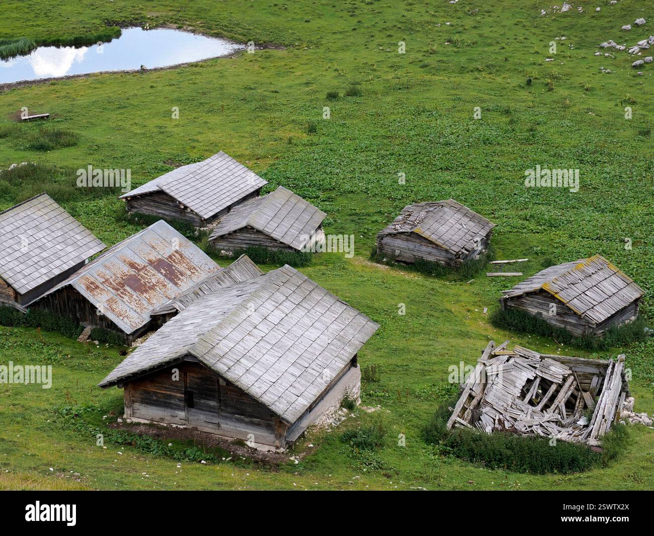 ruins of collapsed wooden hut in dolomites view Stock Photo - Alamy