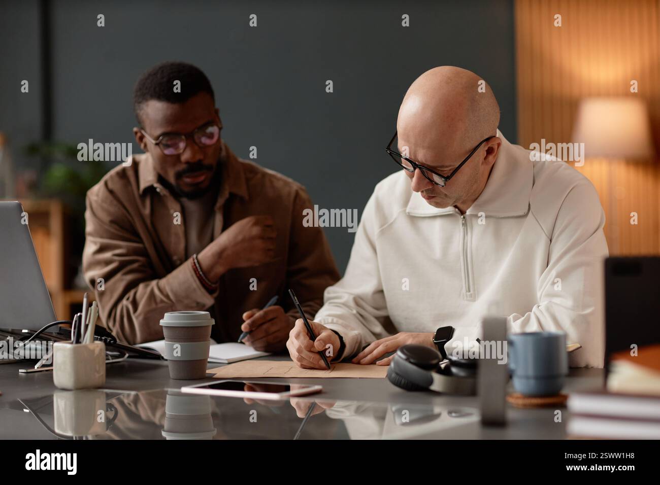 Professional bald man glasses engaged hi-res stock photography and ...