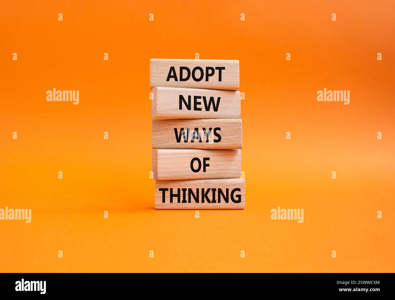 Adopt new ways of thinking symbol. Wooden blocks with words Adopt new ...