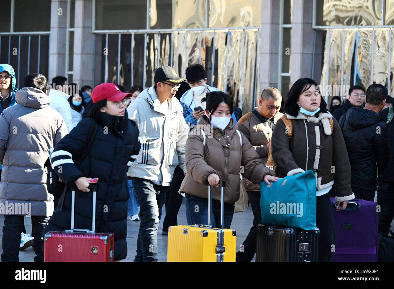 People returning to Beijing from Beijing Railway Station on February 22 ...