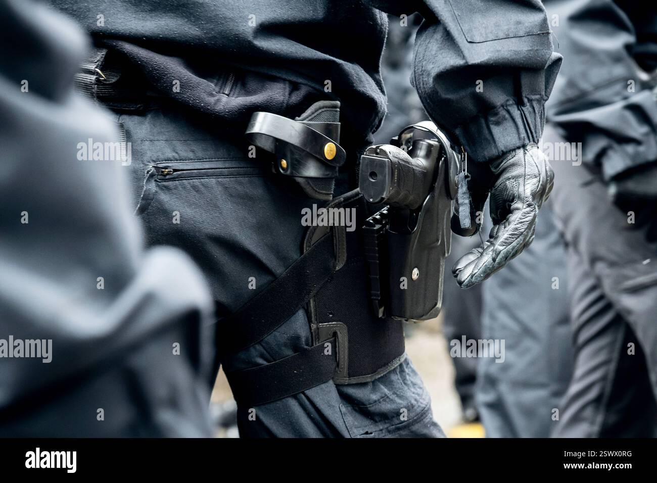 Munich, Bavaria, Germany - February 16, 2025: A police officer carries ...
