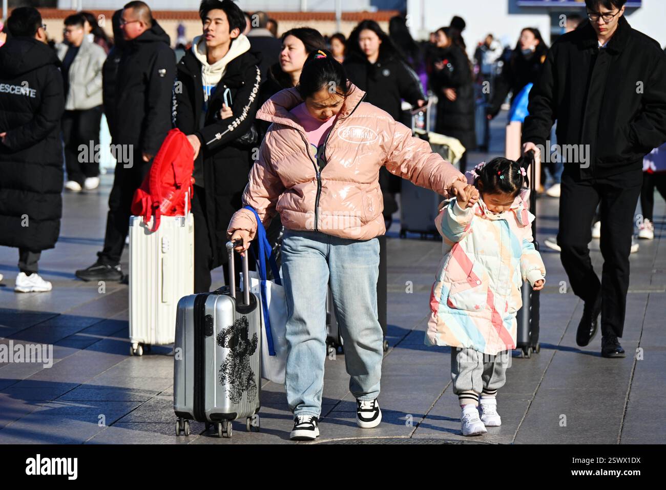 People returning to Beijing from Beijing Railway Station on February 22 ...