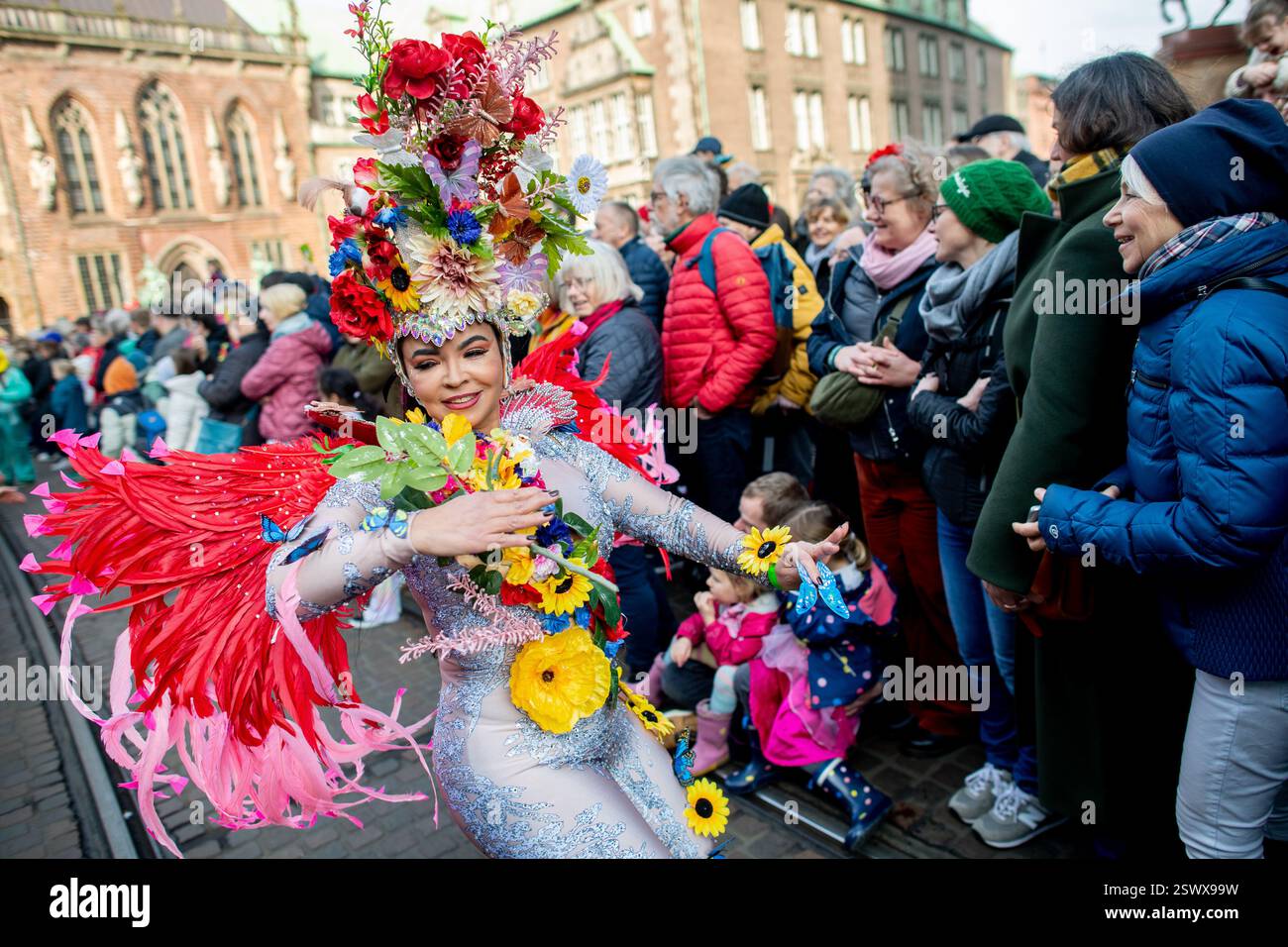 Bremen, Germany. 22nd Feb, 2025. Actors in colorful costumes parade ...