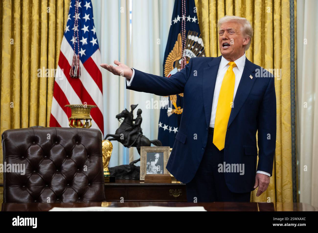 President Donald Trump speaks with reporters in the Oval Office at the ...