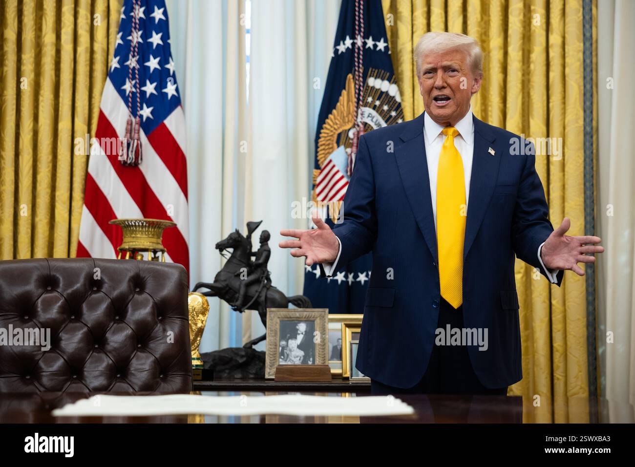 President Donald Trump speaks with reporters in the Oval Office at the ...