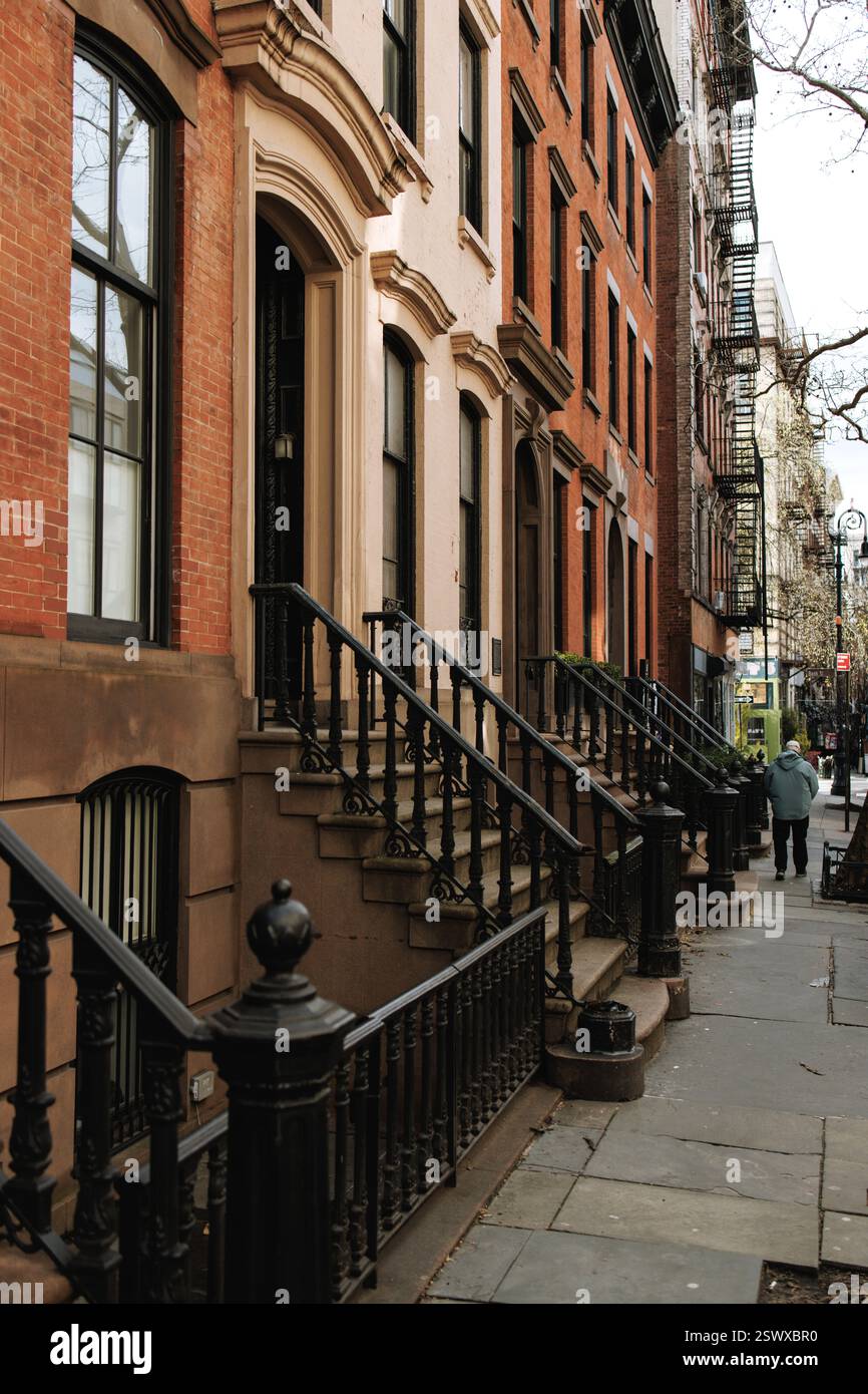 NEW YORK, USA - APRIL 4, 2024: Classic brownstone rowhouses with ornate ...