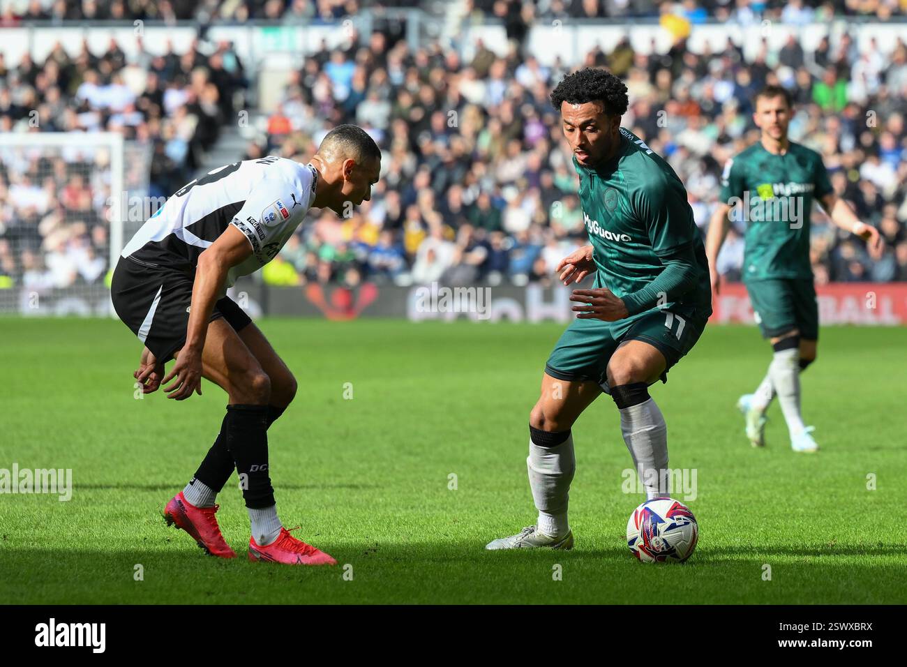 Femi Azeez of Millwall under pressure from Kayden Jackson of Derby ...