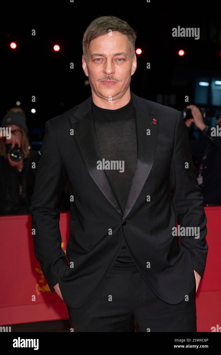 Tom Wlaschiha poses for photographers upon arrival on the red carpet ...