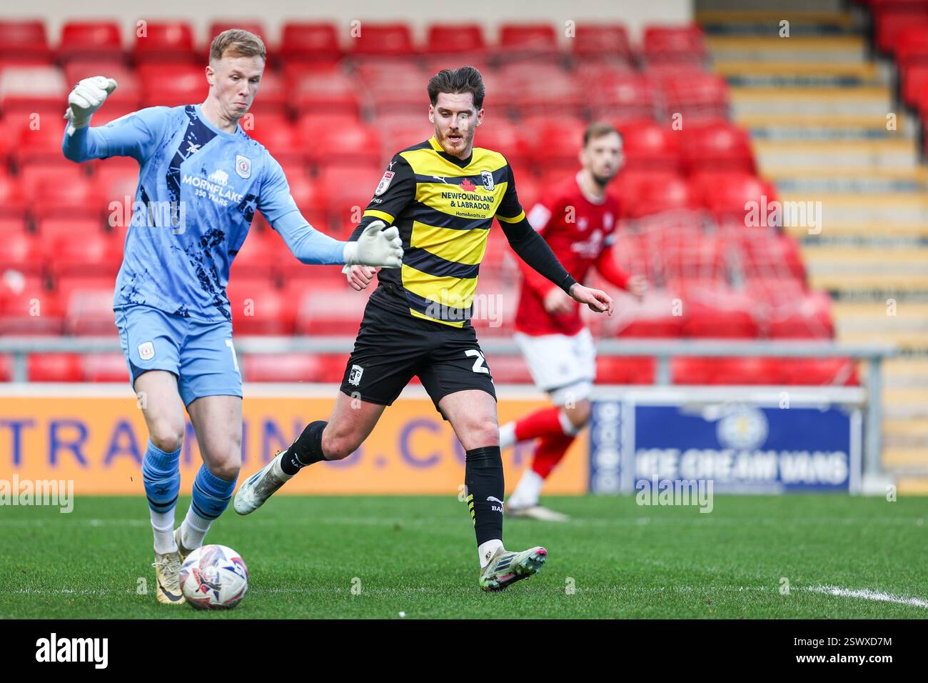 #23, Connor Mahoney of Barrow AFC pressures #12, goalkeeper Filip ...