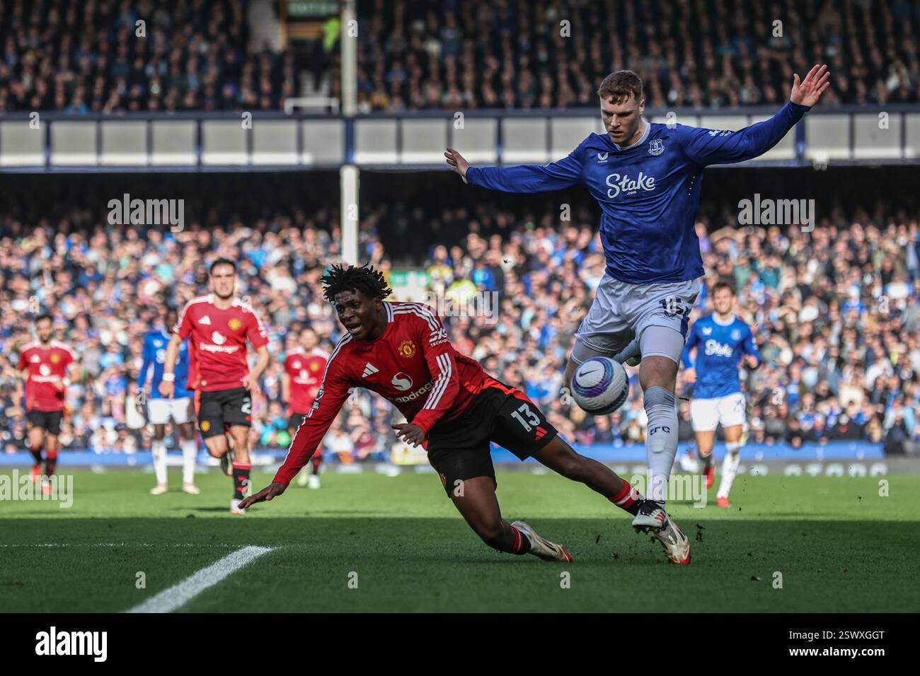 Patrick Dorgu of Manchester United is fouled by Jake O'Brien of Everton ...