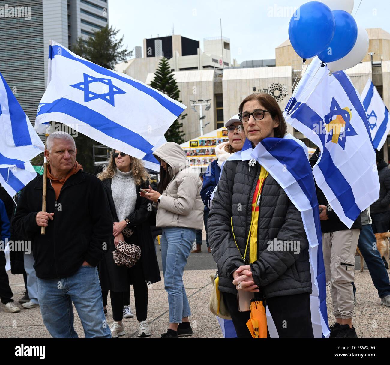 People gather in Hostage Square in Tel Aviv to watch a live broadcast ...