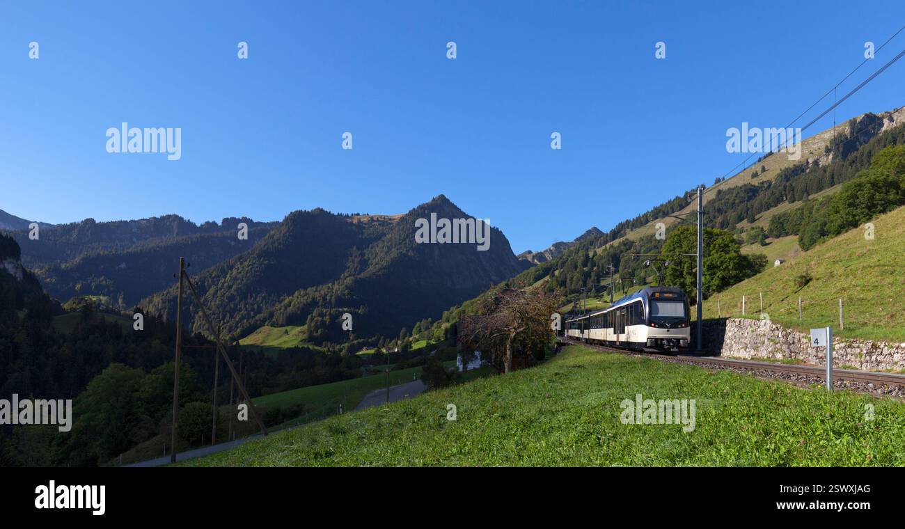 Swiss Golden pass train passing the countryside at Allières ...