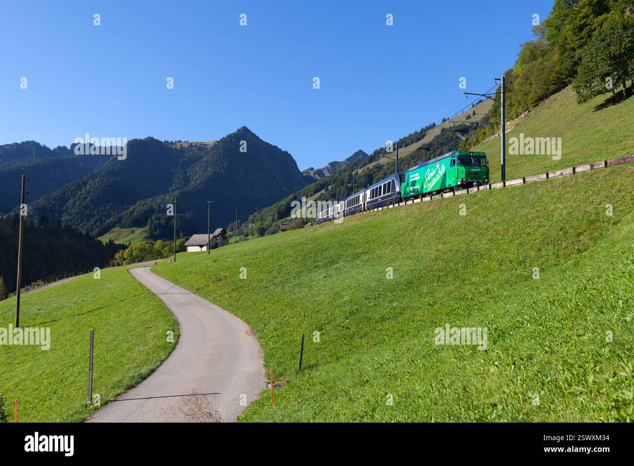 The Swiss Golden pass express train passes the countryside at Allières ...