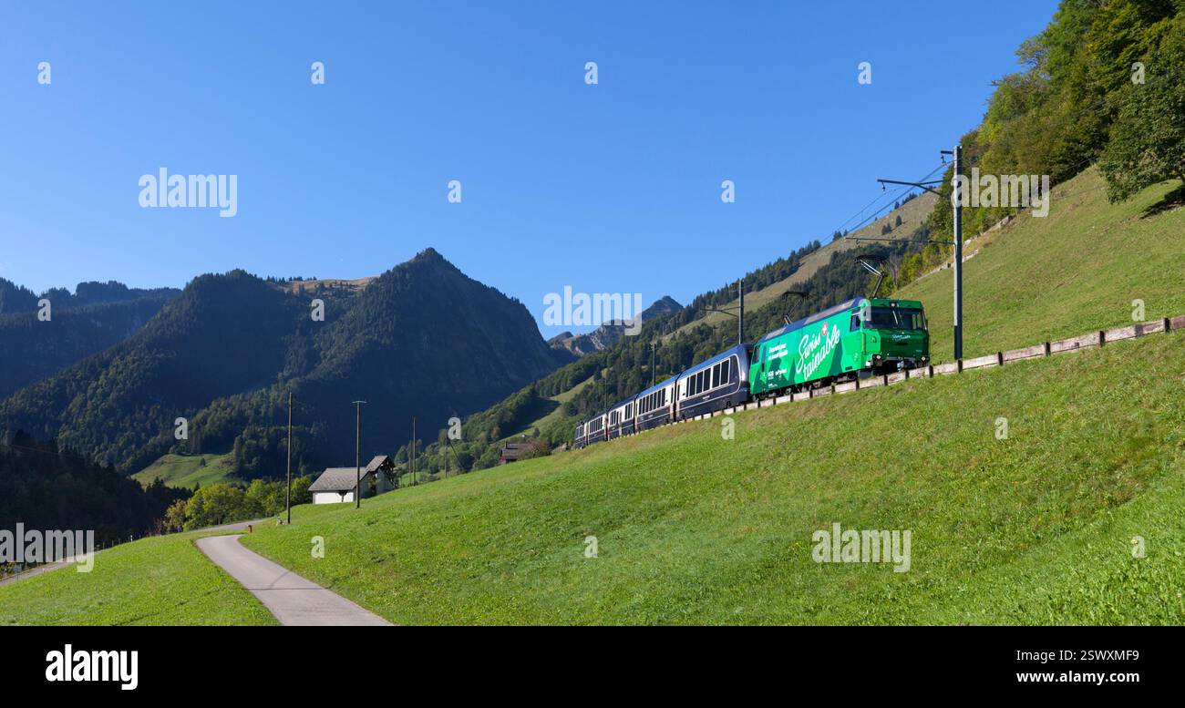 The Swiss Golden pass express train passes the countryside at Allières ...