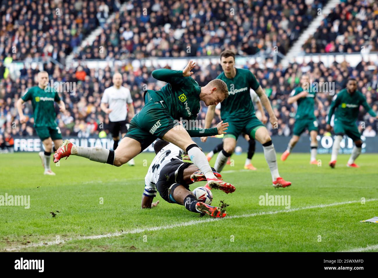 Derby County's Ebou Adams (left) Millwall's George Saville (right ...