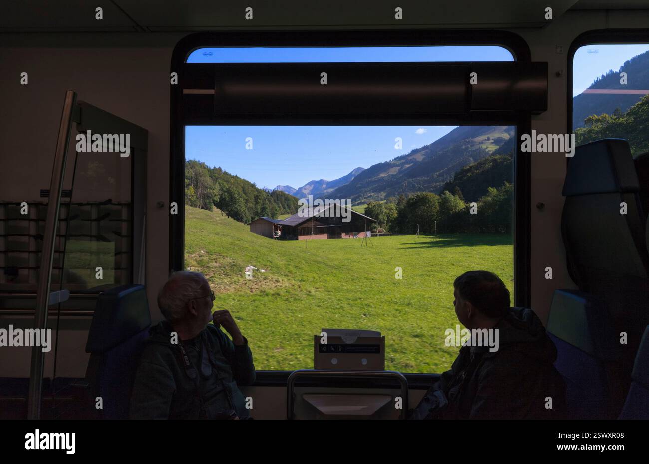 Passengers taking in the view from the train window on the Golden pass ...