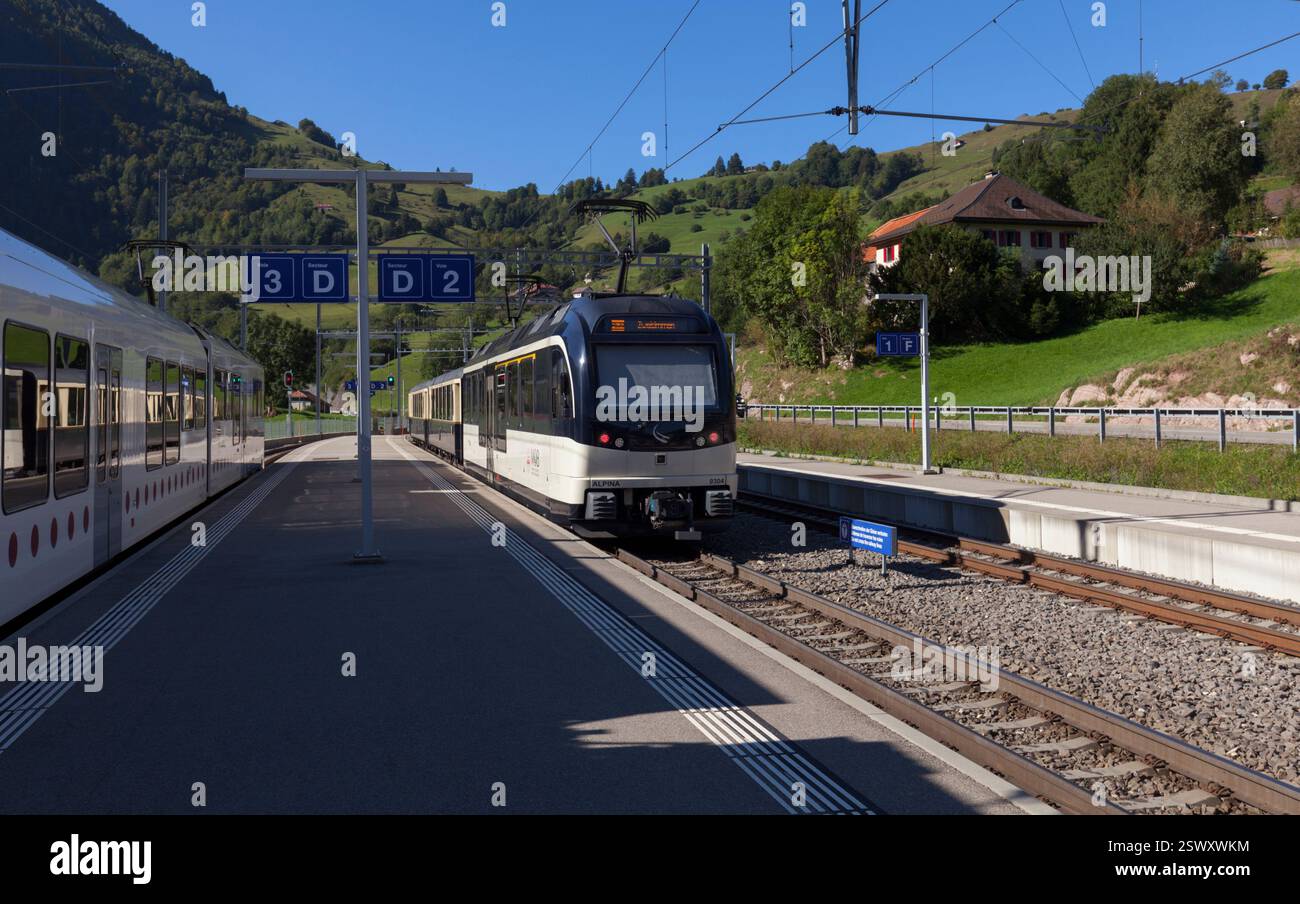 Train at Montbovon railway station (Switzerland) on the Golden Pass ...