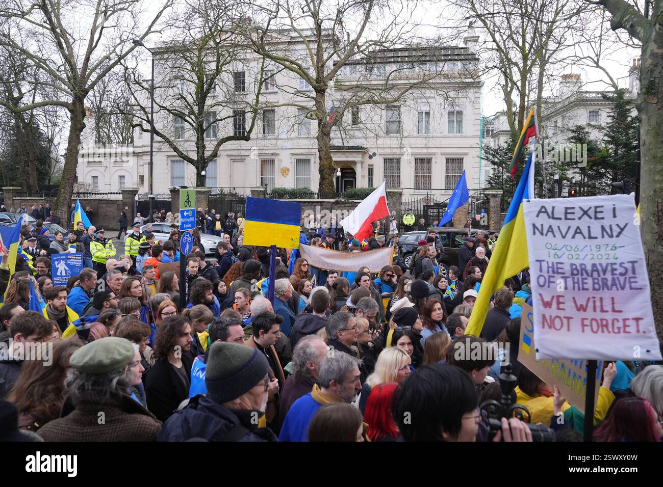 People taking part in a protest outside the Russian Embassy in central ...