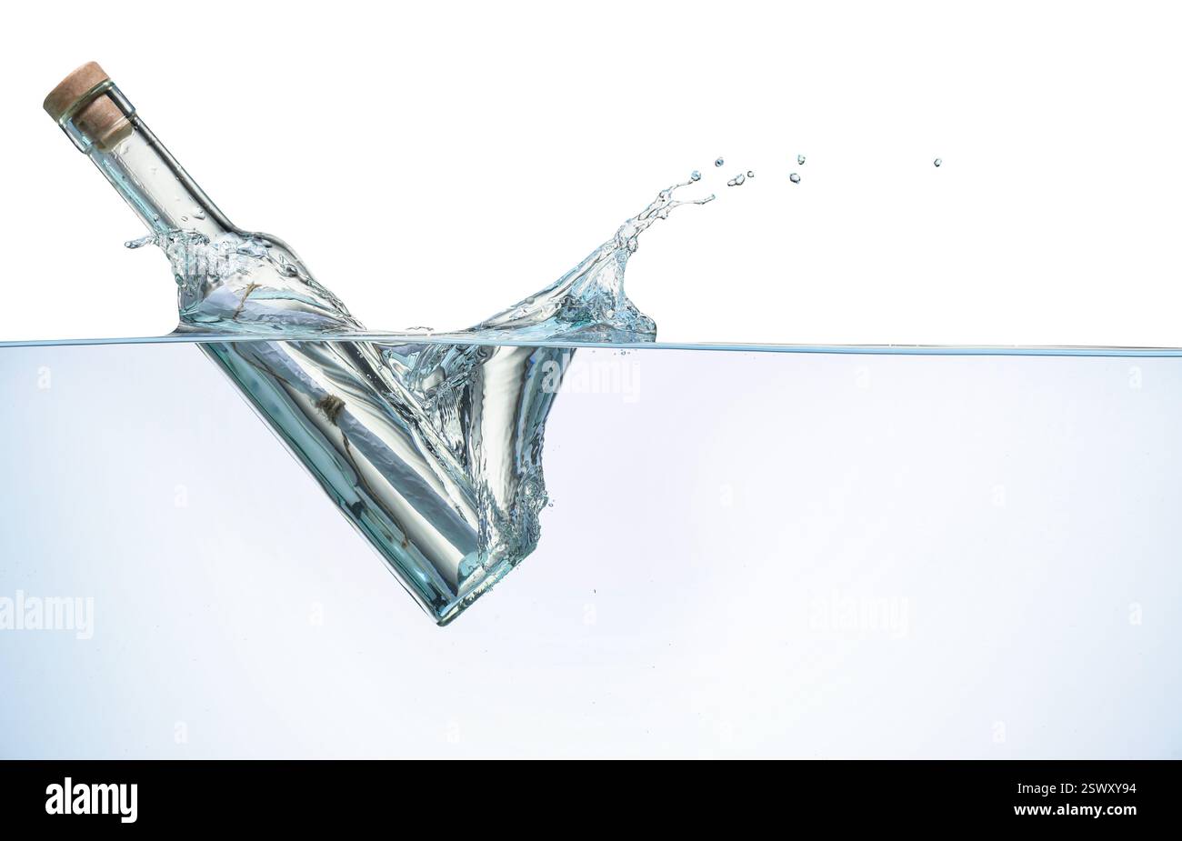 Corked glass bottle with rolled letter in water on white background ...