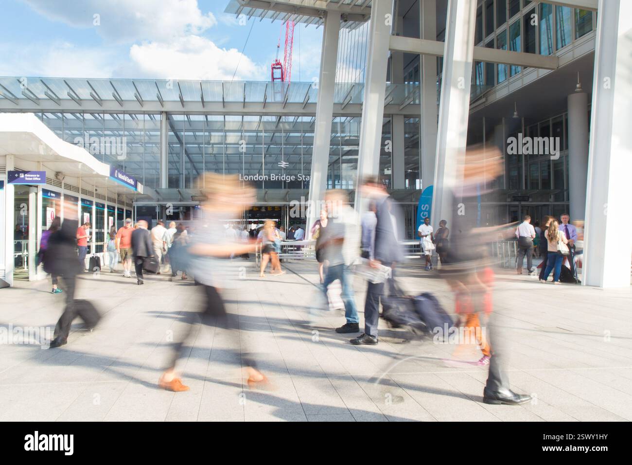 Commuters rush through London Bridge Station. Busy travel hub in London ...