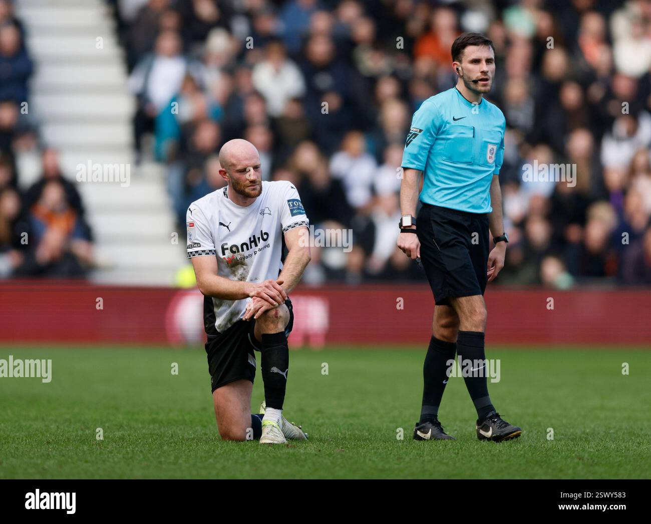 Derby County's Matt Clarke picks up an injury during the Sky Bet ...
