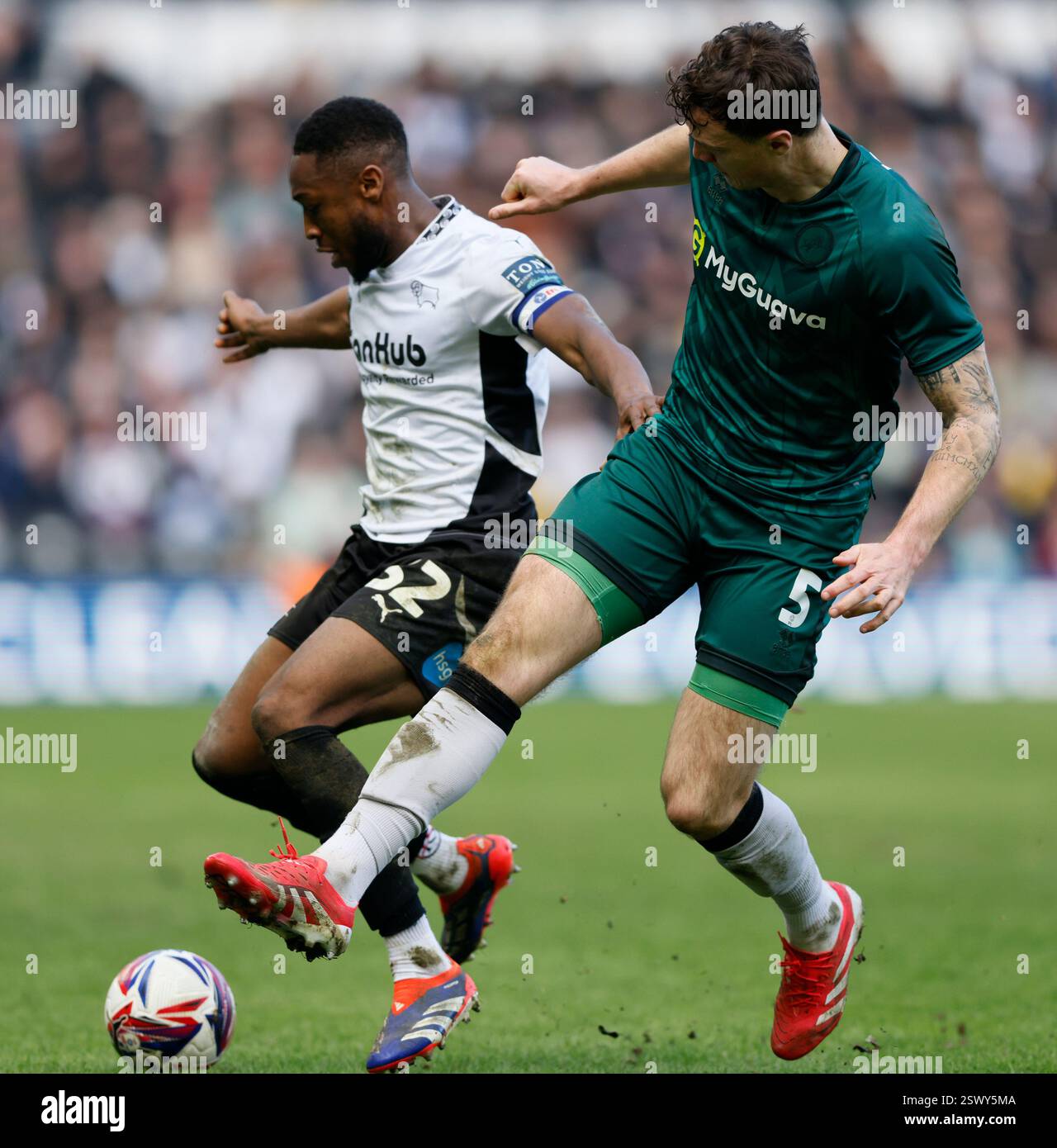 Derby County's Ebou Adams (left) and Millwall's Jake Cooper battle for ...