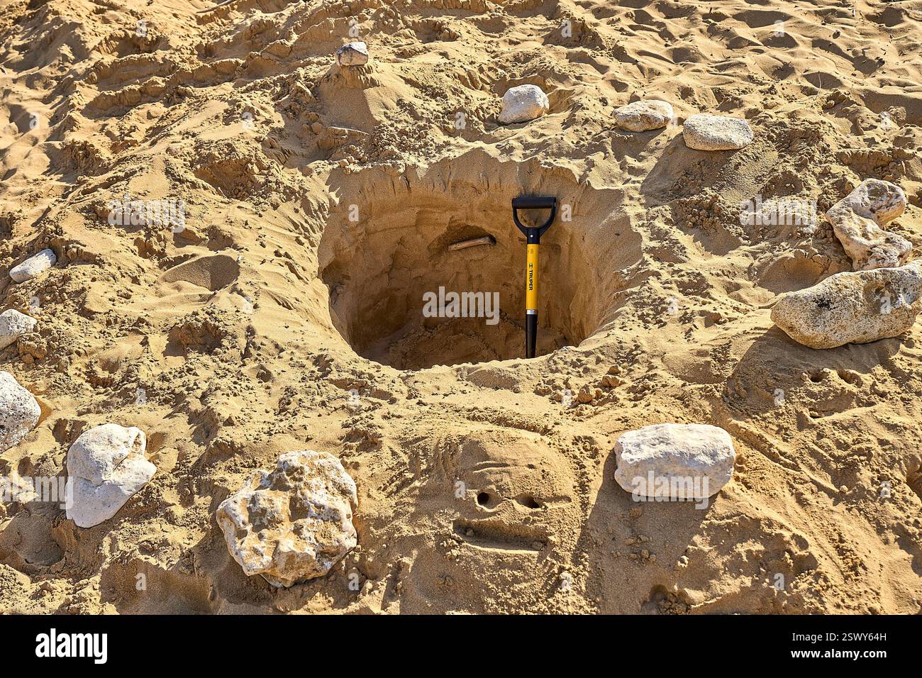Malta - December 4, 2023: A sand pit with a shovel on the beach ...