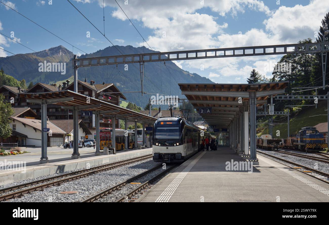 Train at Gstaad railway station (Switzerland) on the Golden Pass ...